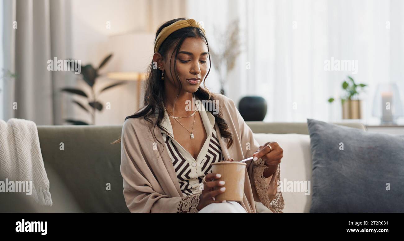 Woman eating ice cream sofa hi-res stock photography and images - Alamy