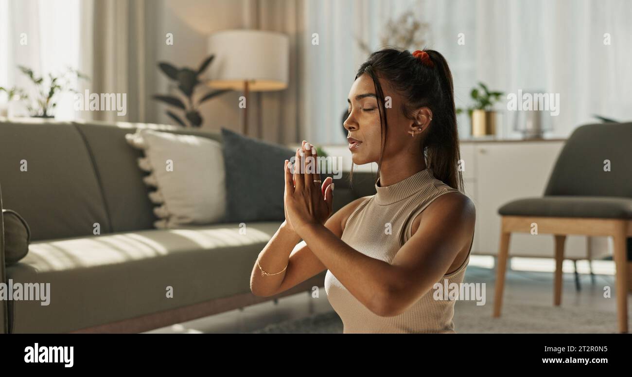 Woman, yoga and meditation with praying hands in living room for zen ...