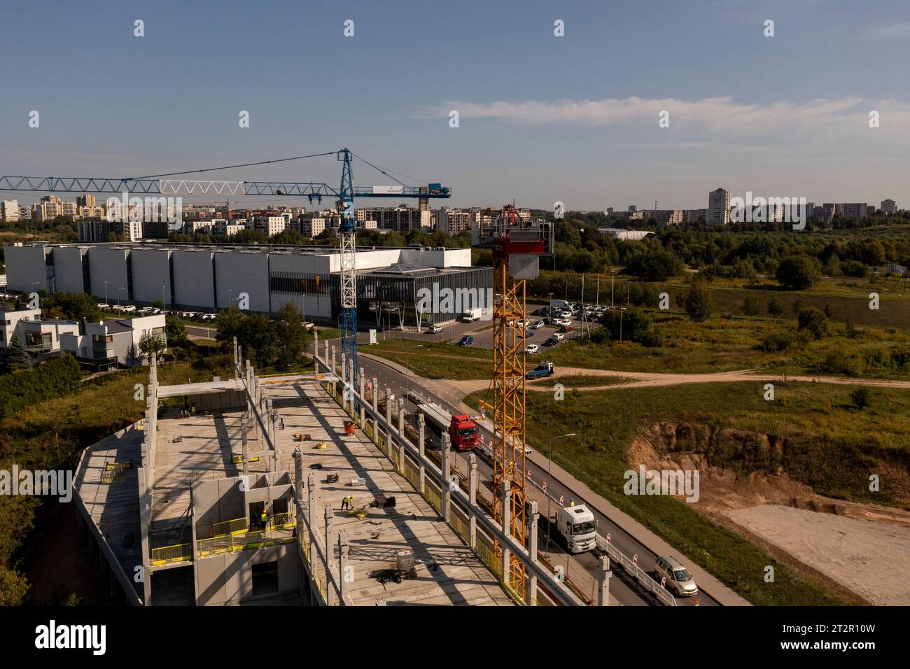 Drone photography of new office building construction site, cranes and ...