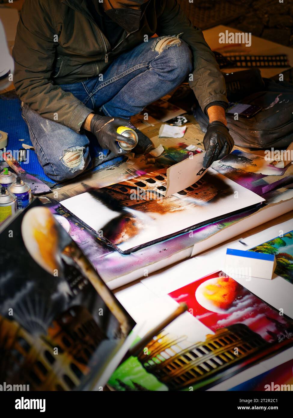 Street artist aerosol spray painting Colosseum, Rome, Italy Stock Photo ...
