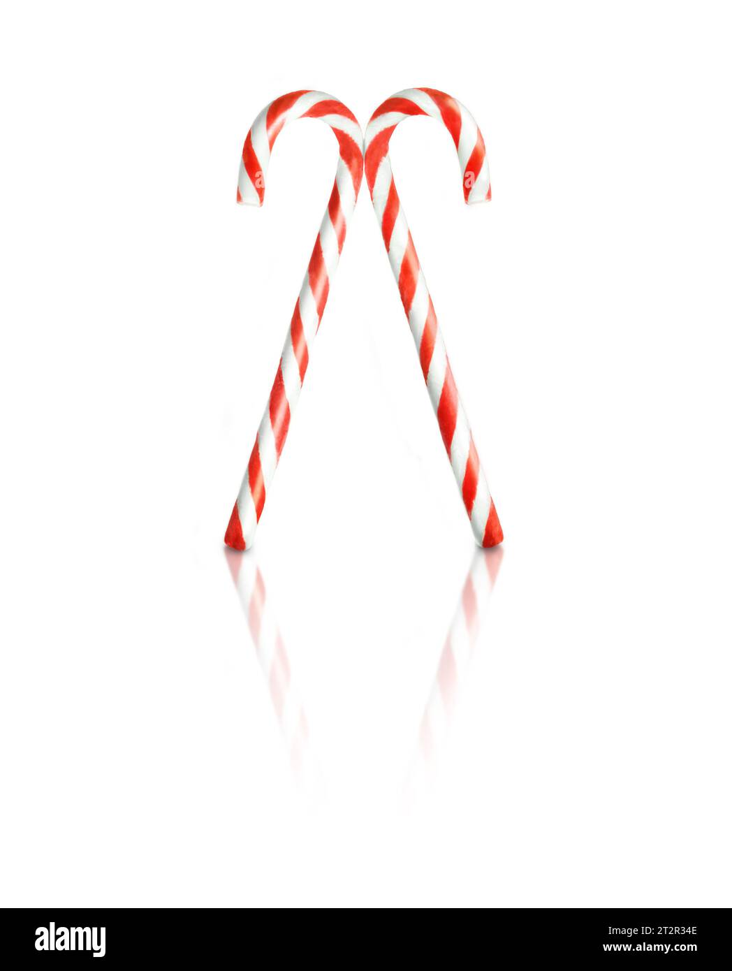 Christmas candy cane leaning on top of each other isolated on white ...