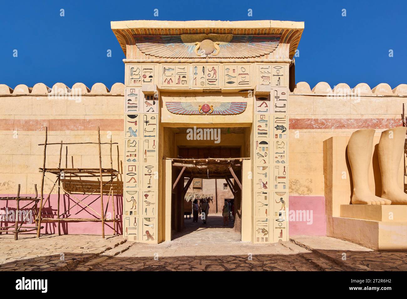 Entrance to the ancient Egyptian temple with winged scarab over the ...