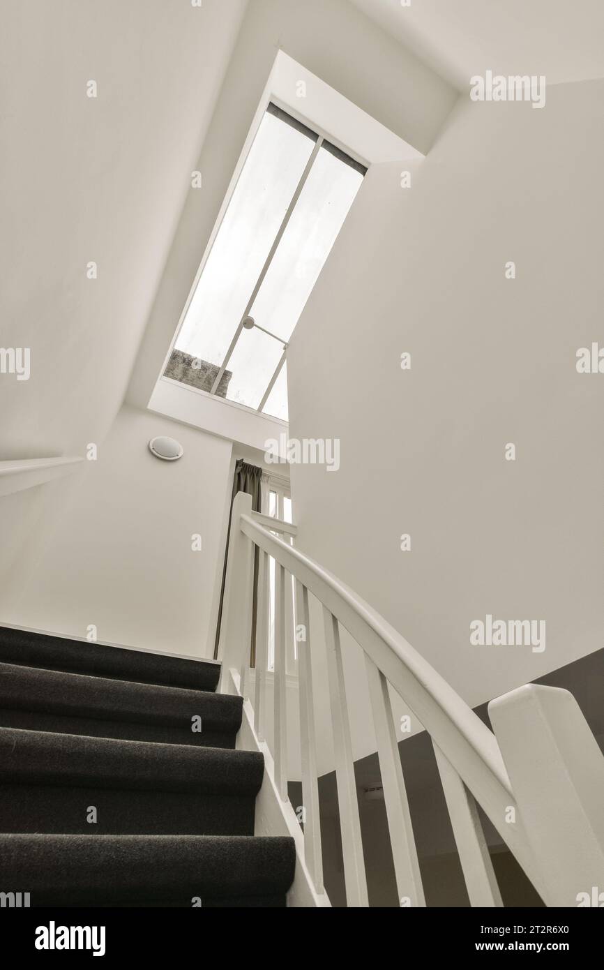 some stairs in a house with skylights on the top and bottom, as seen ...