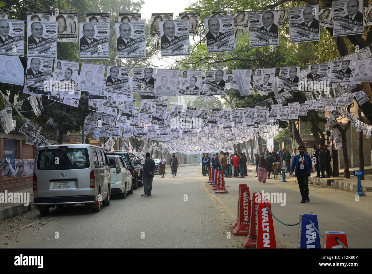 An election campaign poster hangs along a street during the Dhaka North ...