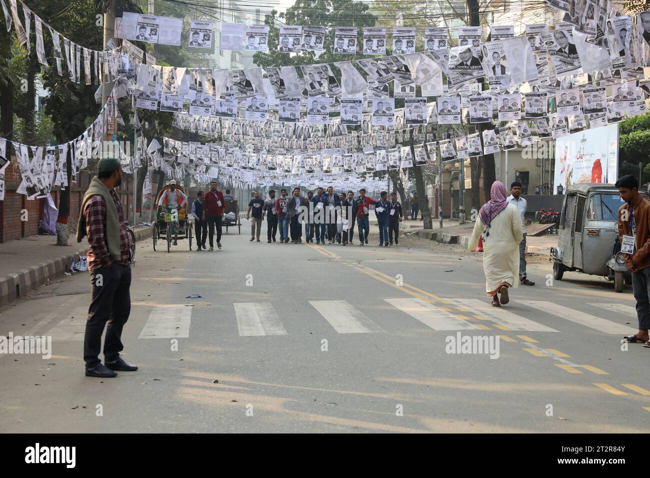 An election campaign poster hangs along a street during the Dhaka North ...