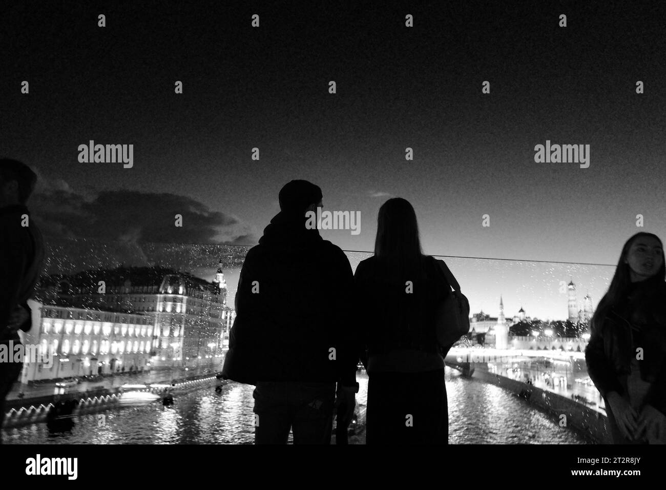 Moscow. Bridge over the Moskva River. Silhouettes of people. Evening ...