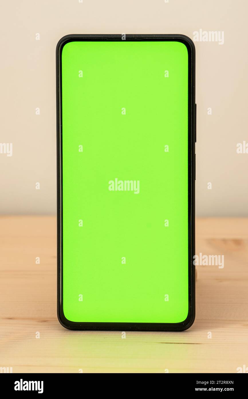 Smartphone green screen on table hi-res stock photography and images ...