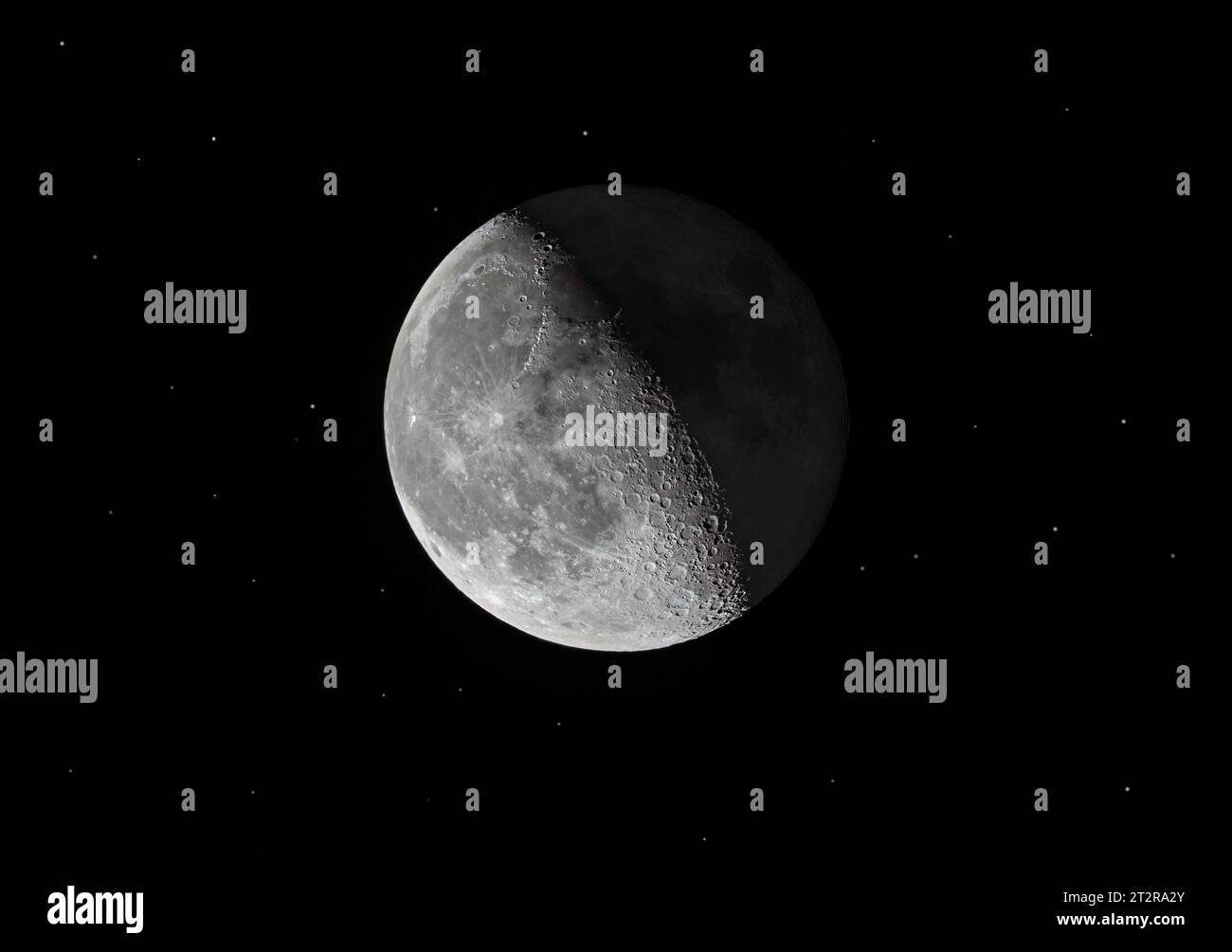 The last quarter moon glowing in the night sky over Ottawa, Canada ...