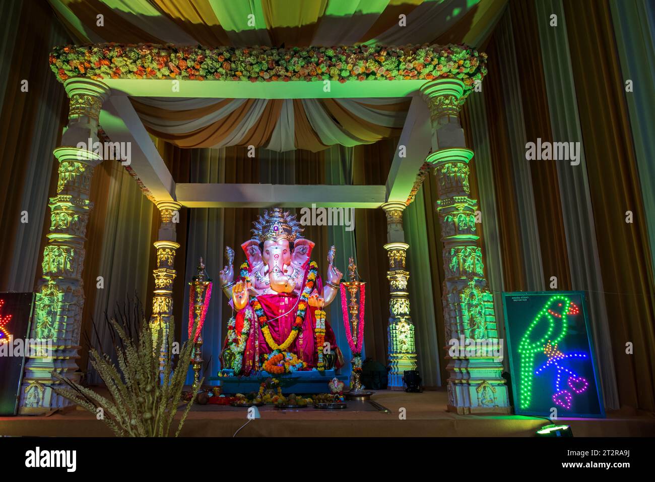 A beautiful idol of Lord Ganesha being worshipped at a mandal in Mumbai ...