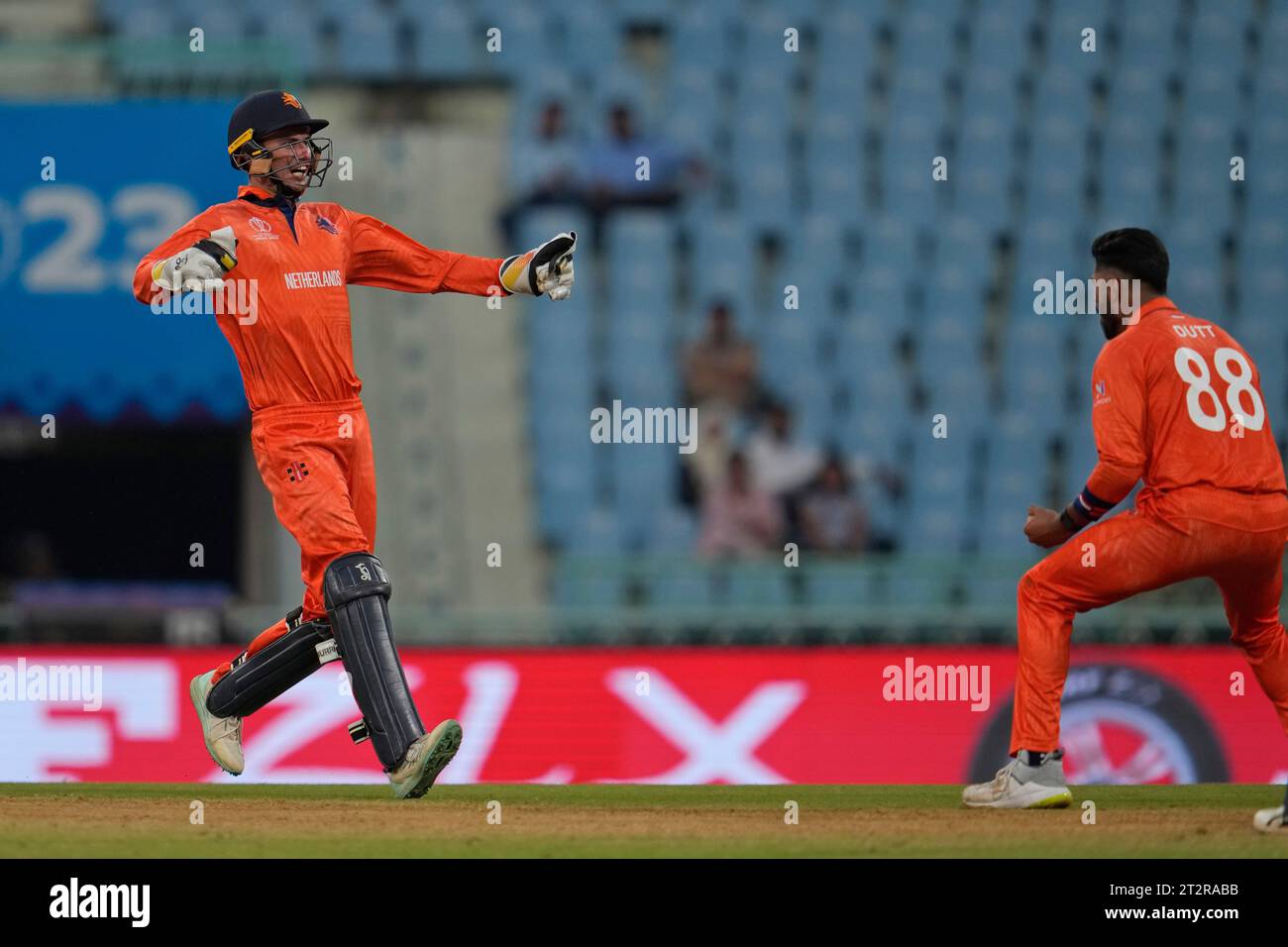 Netherlands' captain Scott Andrew Edwards runs to congratulate Aryan ...