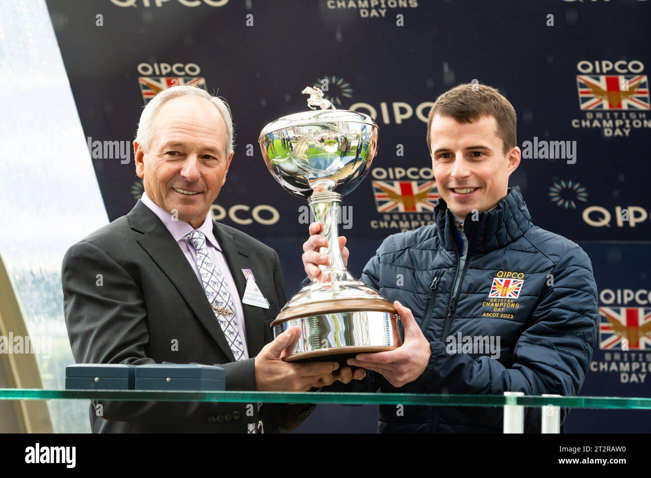 Ascot Racecourse, Berkshire, UK; jockey William Buick is presented with ...