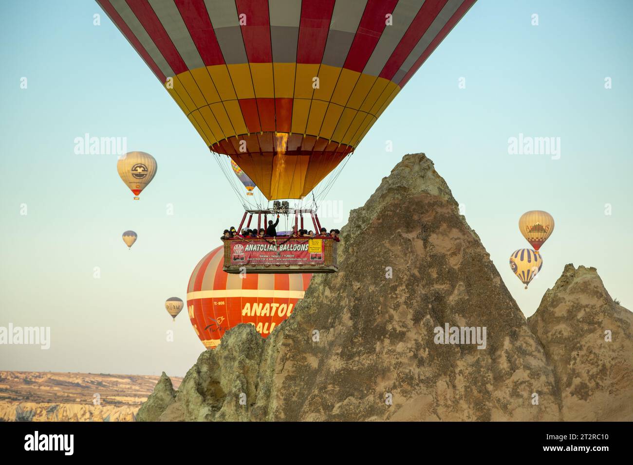 Hot air balloons over rock formations, Rose Valley (Gulludere ...