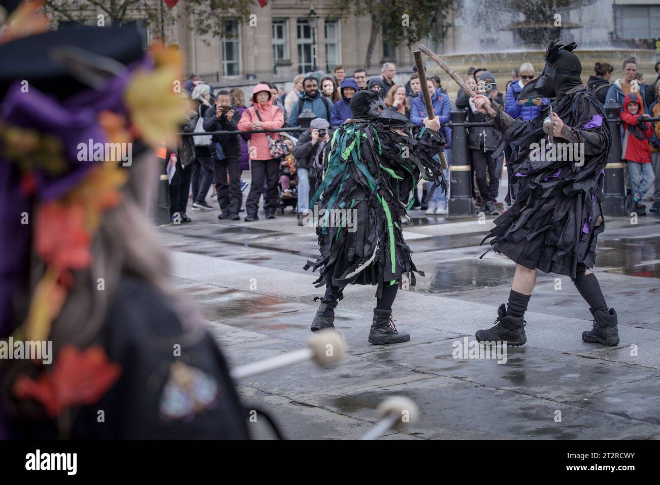 London, UK. 21st Oct 2023. Raven masked morris dancers from Huginn and ...