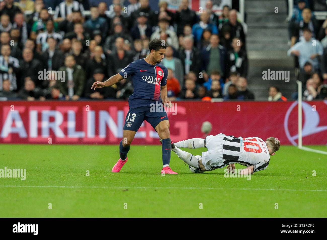 Warren Zaire-Emery of Paris Saint-Germain fouls Anthony Gordon of ...