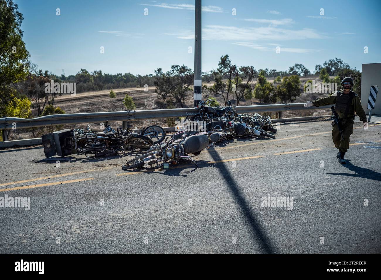 Kissufim, Israel. 21st Oct, 2023. An Israeli soldier inspects destroyed ...