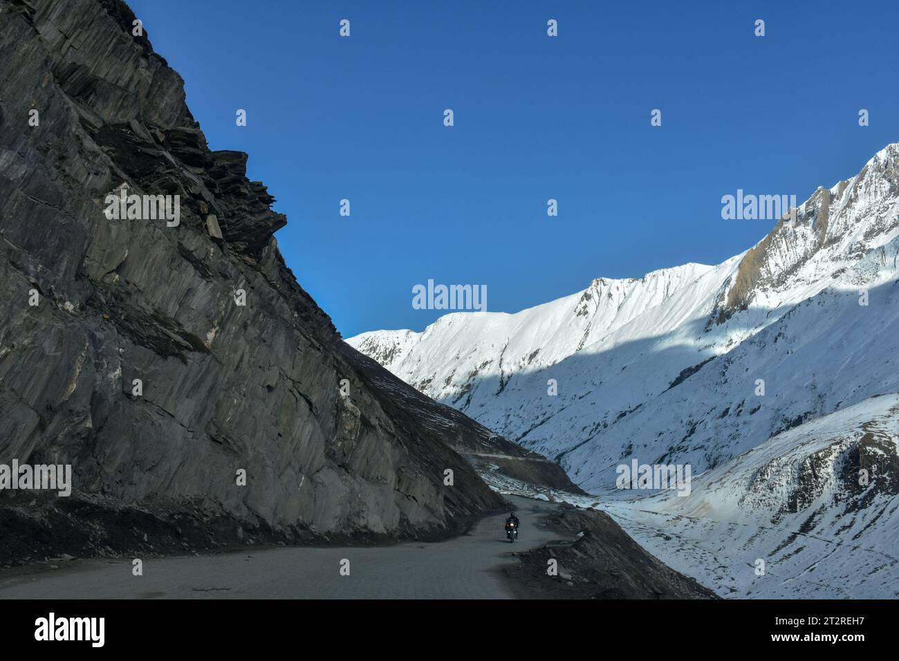 Zoji La, India. 21st Oct, 2023. A bike rider moves through Zojia, a ...