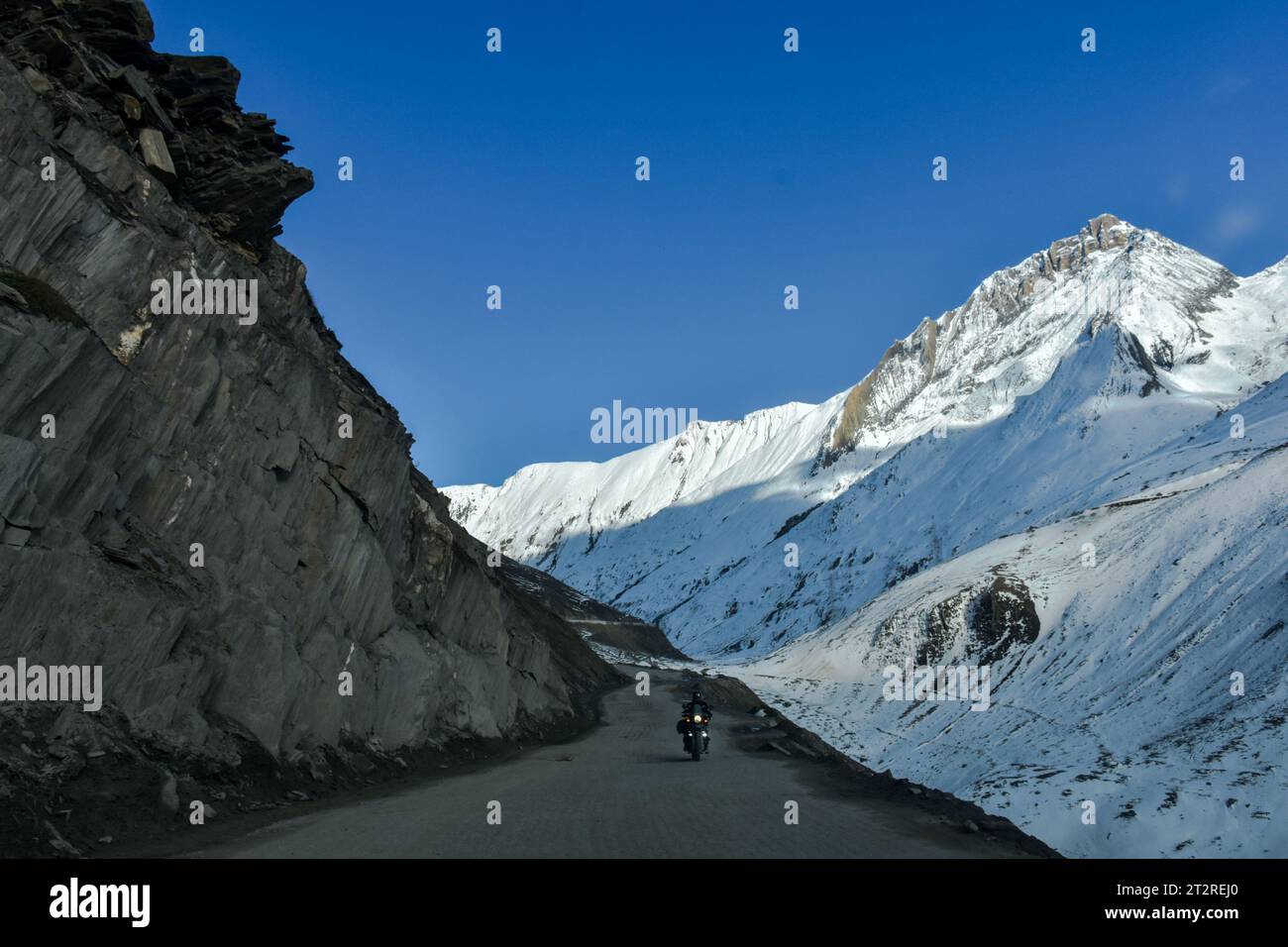 Zoji La, India. 21st Oct, 2023. A bike rider moves through Zojia, a ...