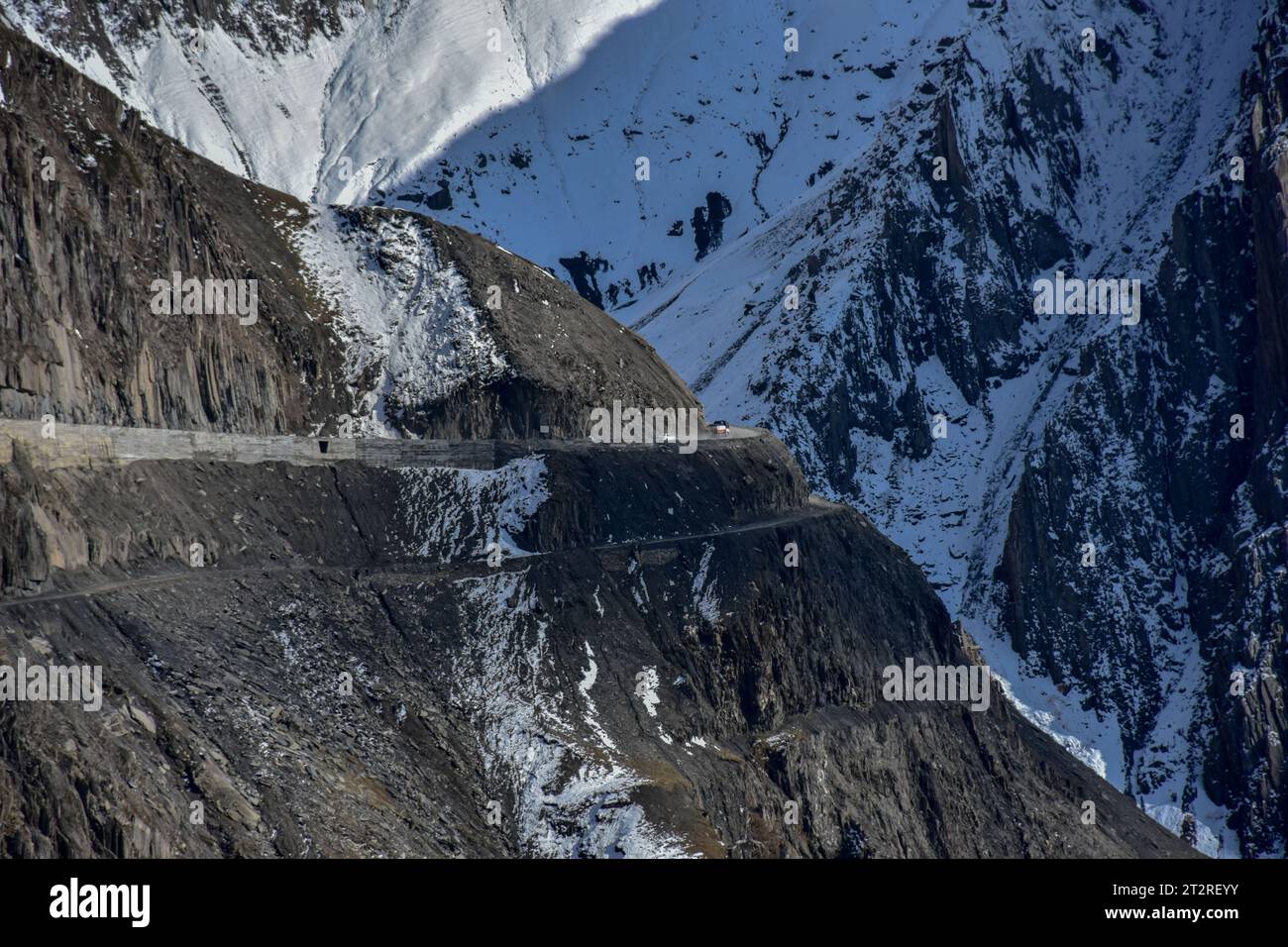 Vehicles move through Zojia, a dangerous mountain pass in the Himalayas ...