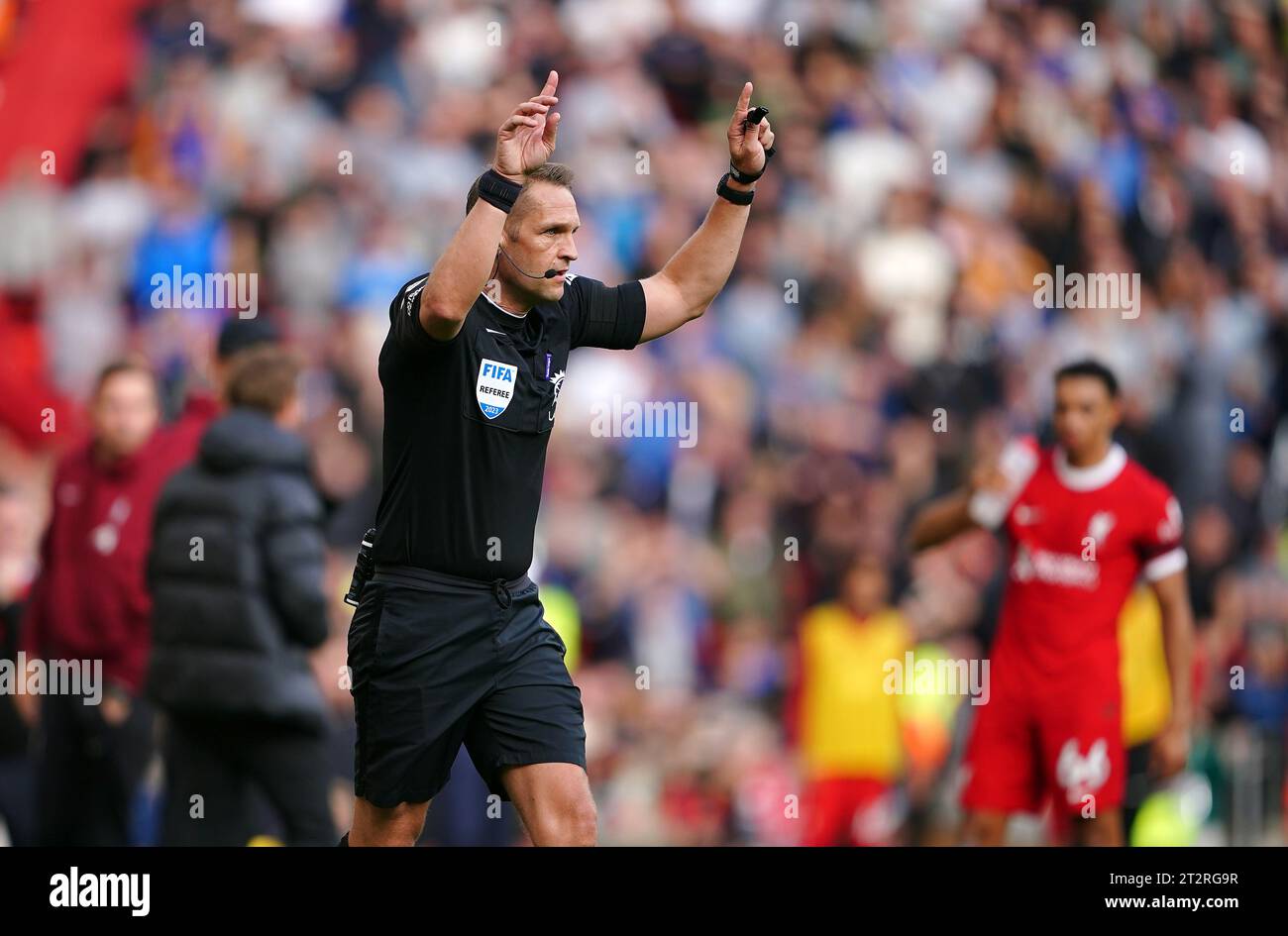 Referee Craig Pawson awards a penalty to Liverpool after checking the ...