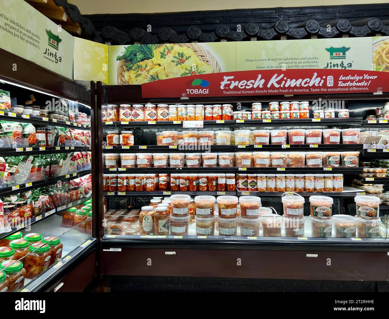 Fresh kimchi refrigerated display inside the Super H Mart Asian grocery ...
