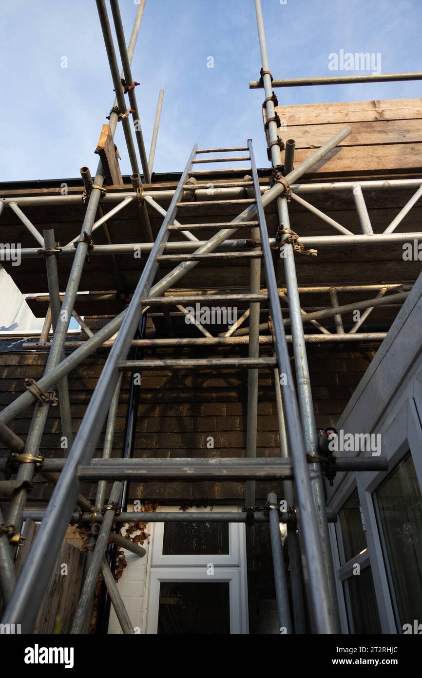 looking up at scaffolding on the external wall of a private residence ...