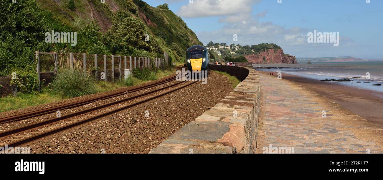 BR Class 800 IET No 800304 runs along the seawall at Teignmouth with a ...