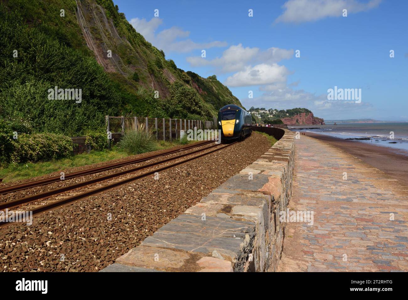 BR Class 800 IET No 800304 runs along the seawall at Teignmouth with a ...