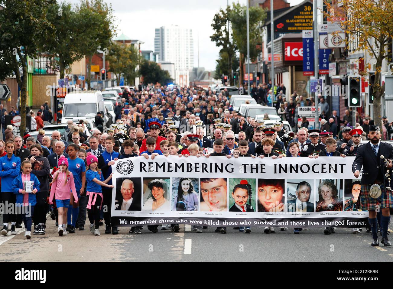 People walk along Shankill Road in Belfast, during an event to mark the ...