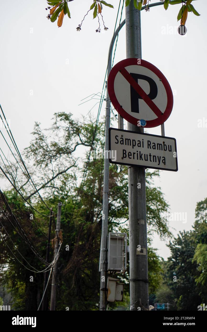 Indonesian. traffic signs that tell you not to parakeet around the sign ...