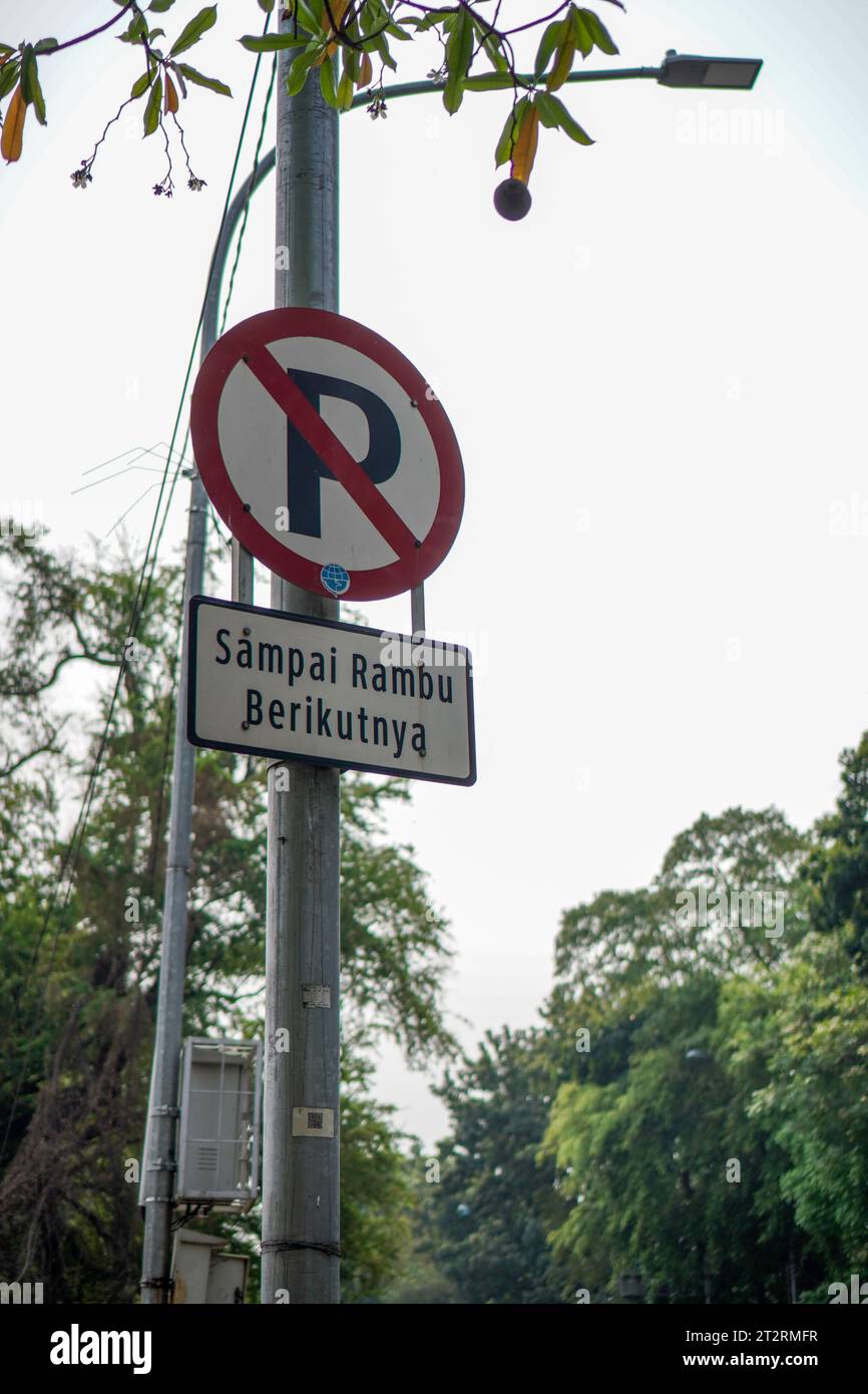 Indonesian. traffic signs that tell you not to parakeet around the sign ...