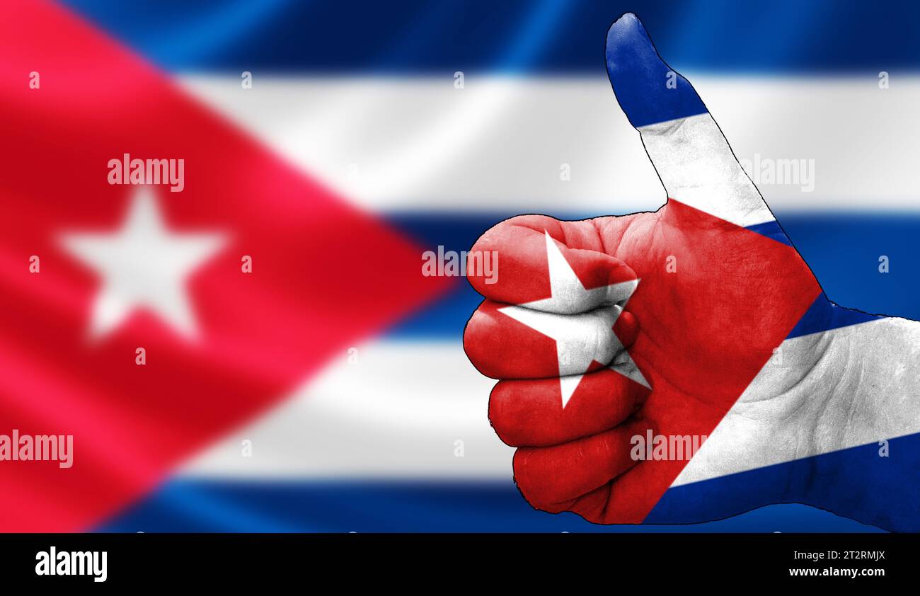 hand with thumbs up in approval with the Cuban flag painted. Image with ...