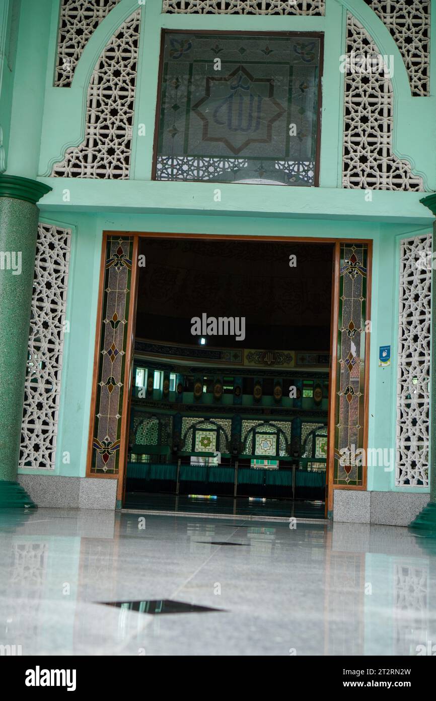 Arabic, Indonesian. Beautiful mosque entrance with Arabic ornaments ...