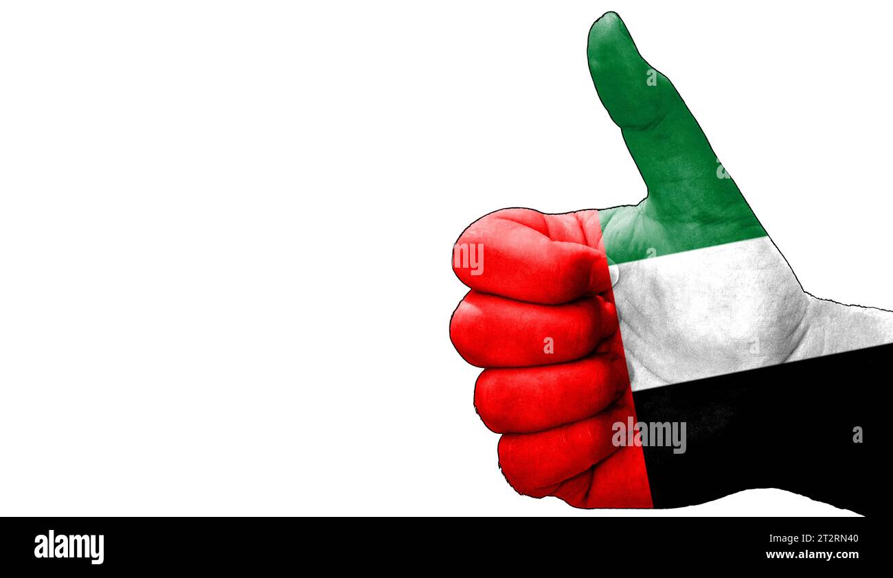 hand with thumbs up in approval with the United arab emirates flag ...