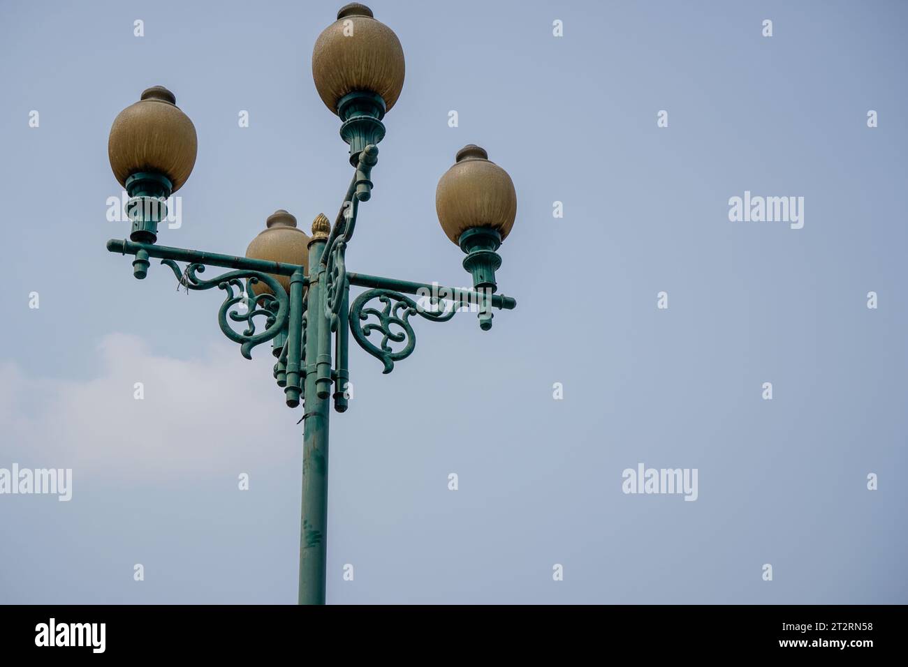 courtyard lamp with a tall pole, seen from below with a view towards ...