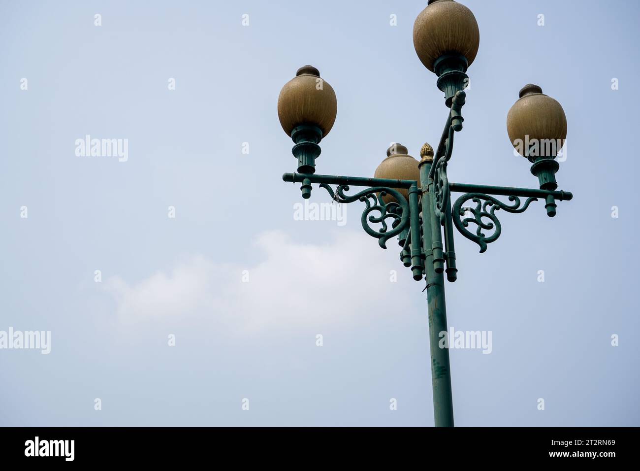 courtyard lamp with a tall pole, seen from below with a view towards ...
