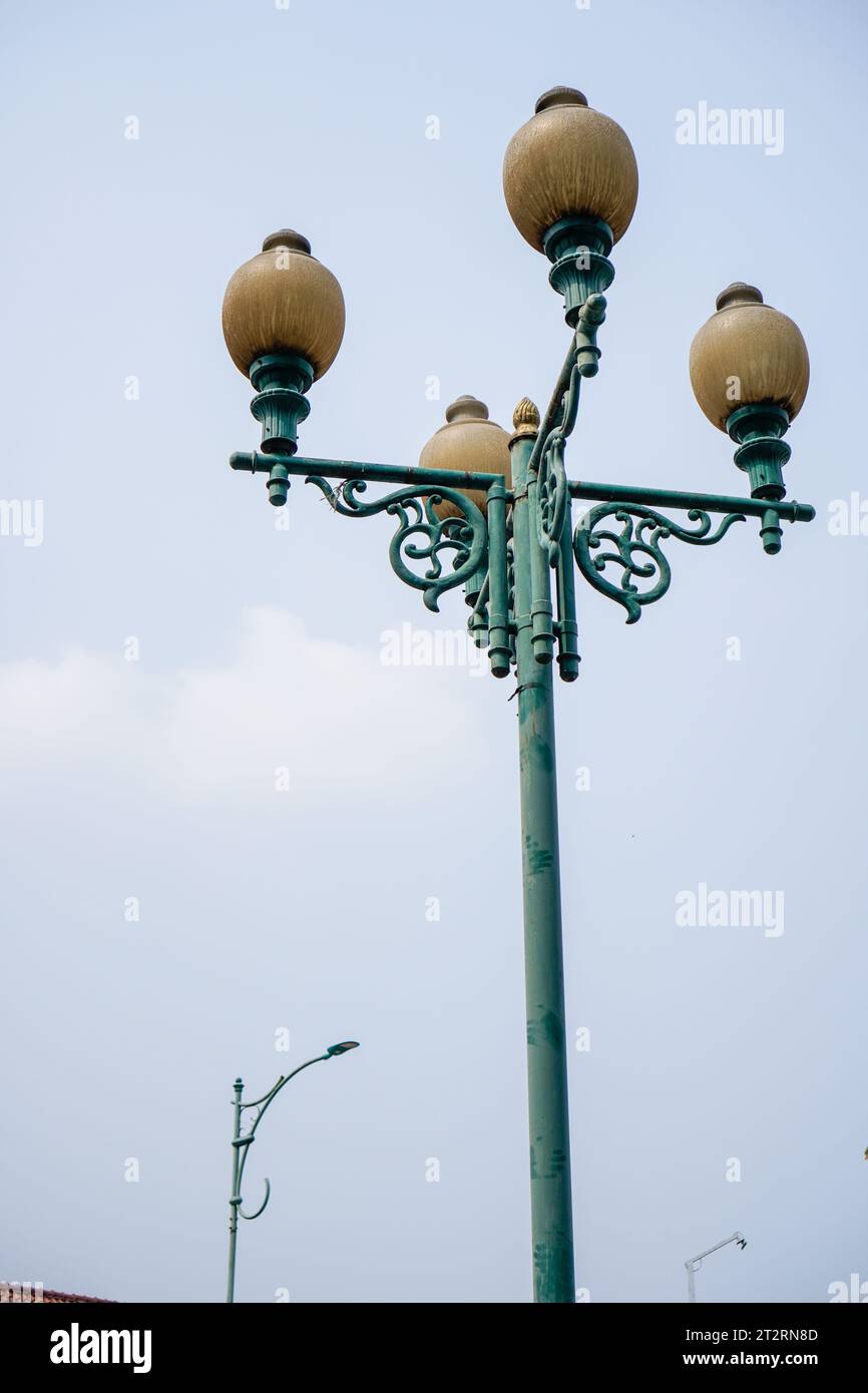 courtyard lamp with a tall pole, seen from below with a view towards ...