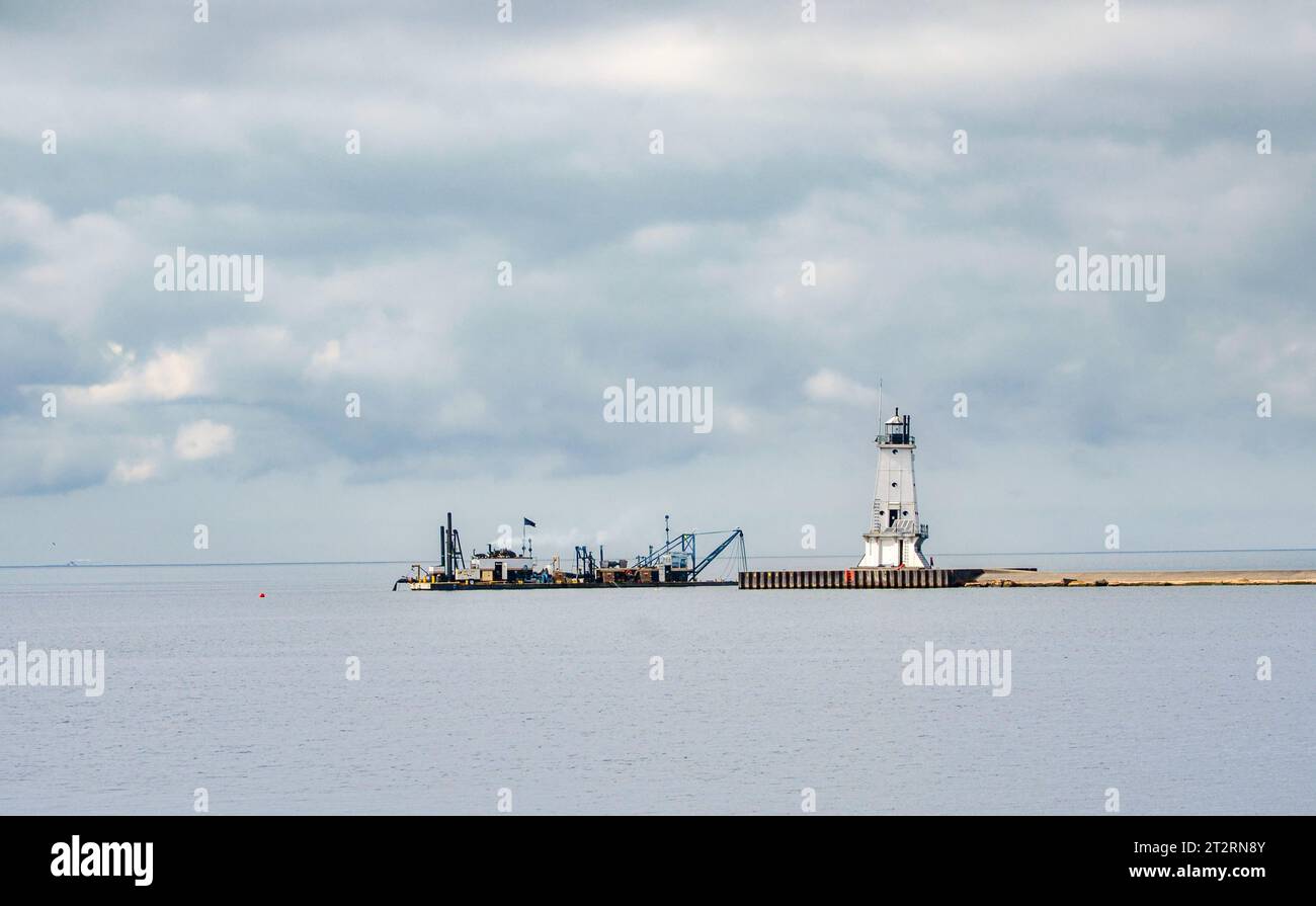 Lighthouse at the end of a pier Stock Photo - Alamy