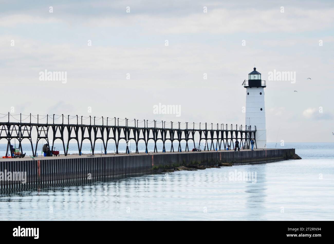Lighthouse at the end of a pier Stock Photo - Alamy