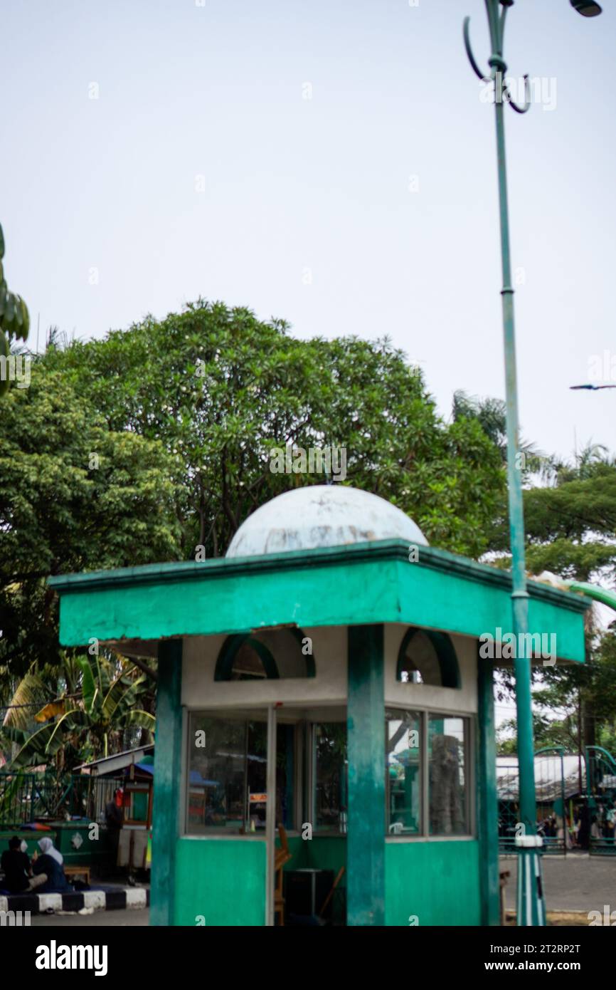 a dome-shaped guard post at the top of the building, and street lights ...