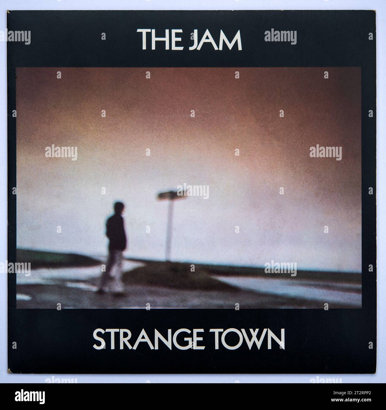 Picture cover of the seven inch single version of Strange Town by The ...