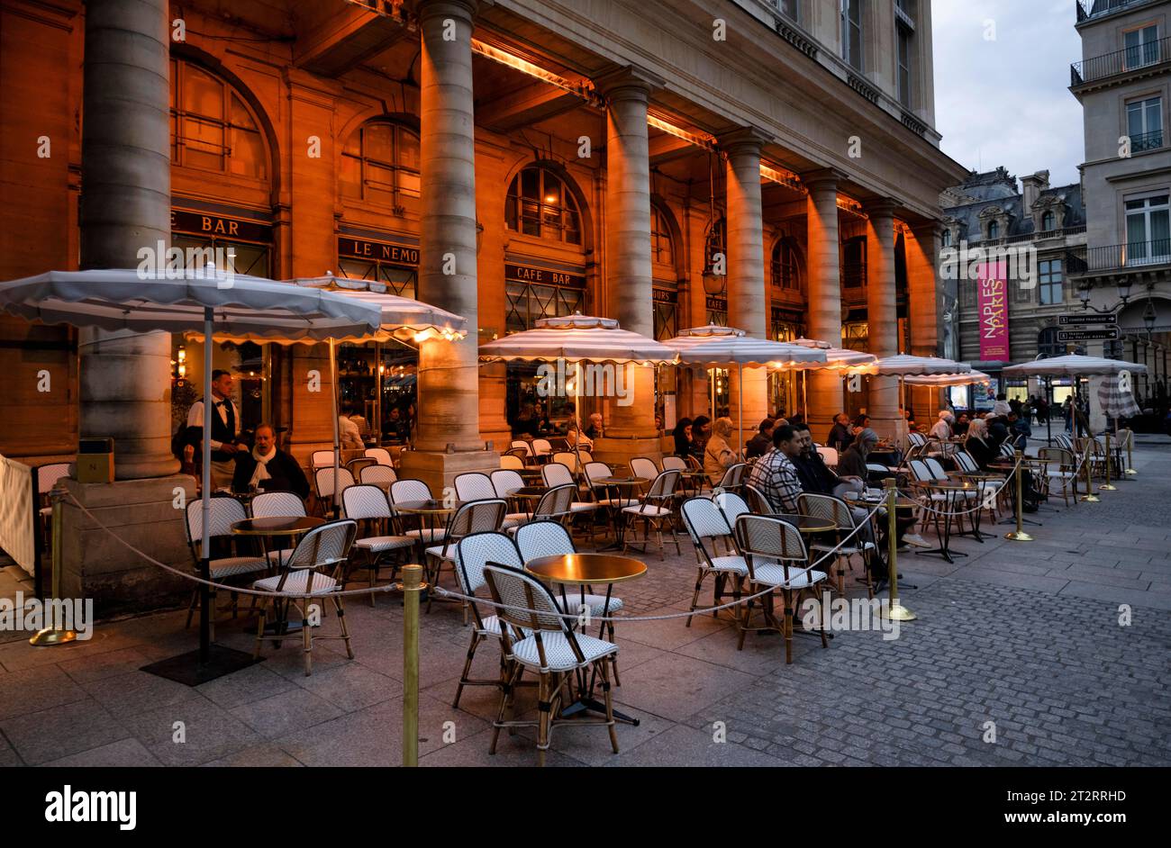Outdoor area, Le Nemours restaurant, evening, Paris, France Stock Photo ...