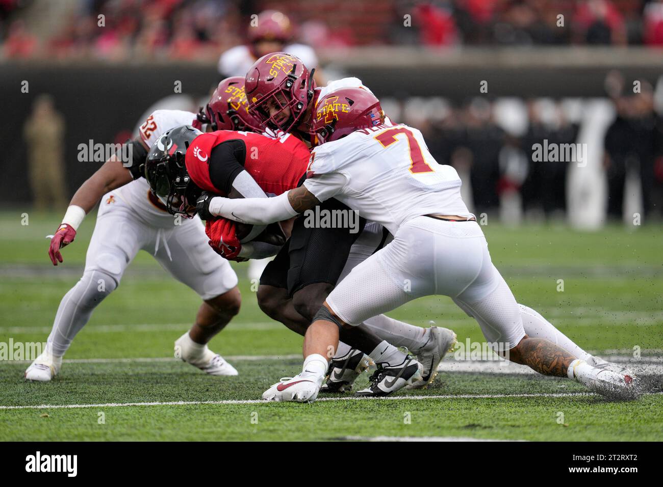 Cincinnati running back Myles Montgomery (26) is tackled by Iowa State ...