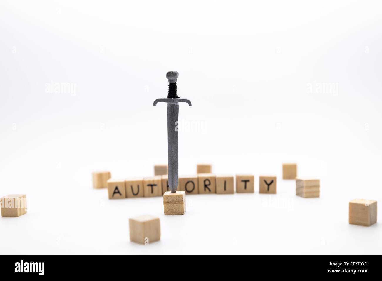 The wooden cubes with the word AUTHORITY and the weapon around against ...
