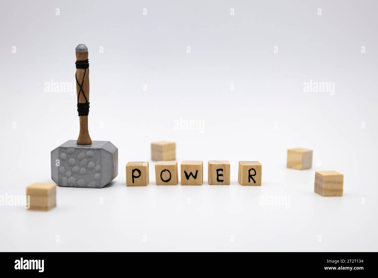 The wooden cubes with the word POWER and the weapon around against ...