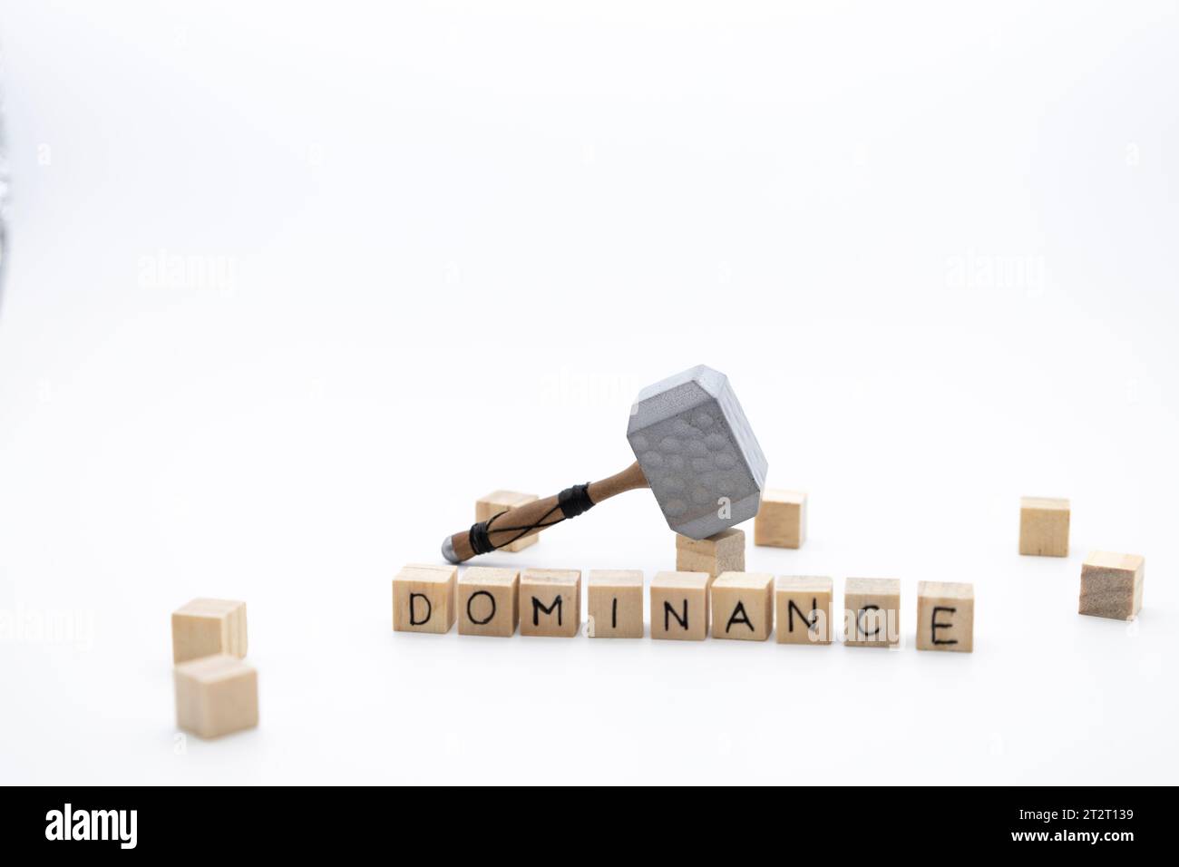 The wooden cubes with the word DOMINANCE and the weapon around against ...