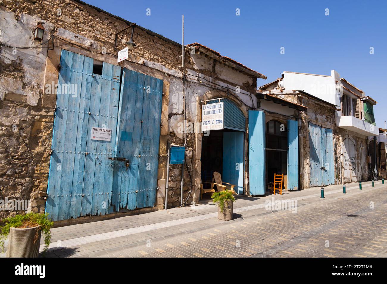 Old workshop buildings with large blue wood doors in old town, Larnaca ...