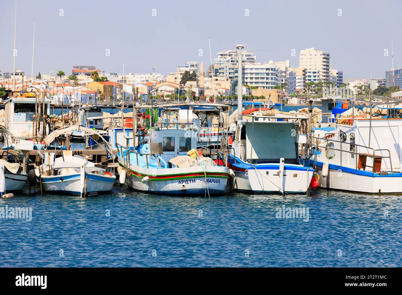 Traditional Cypriot fishing boats moored in the fishing harbour ...