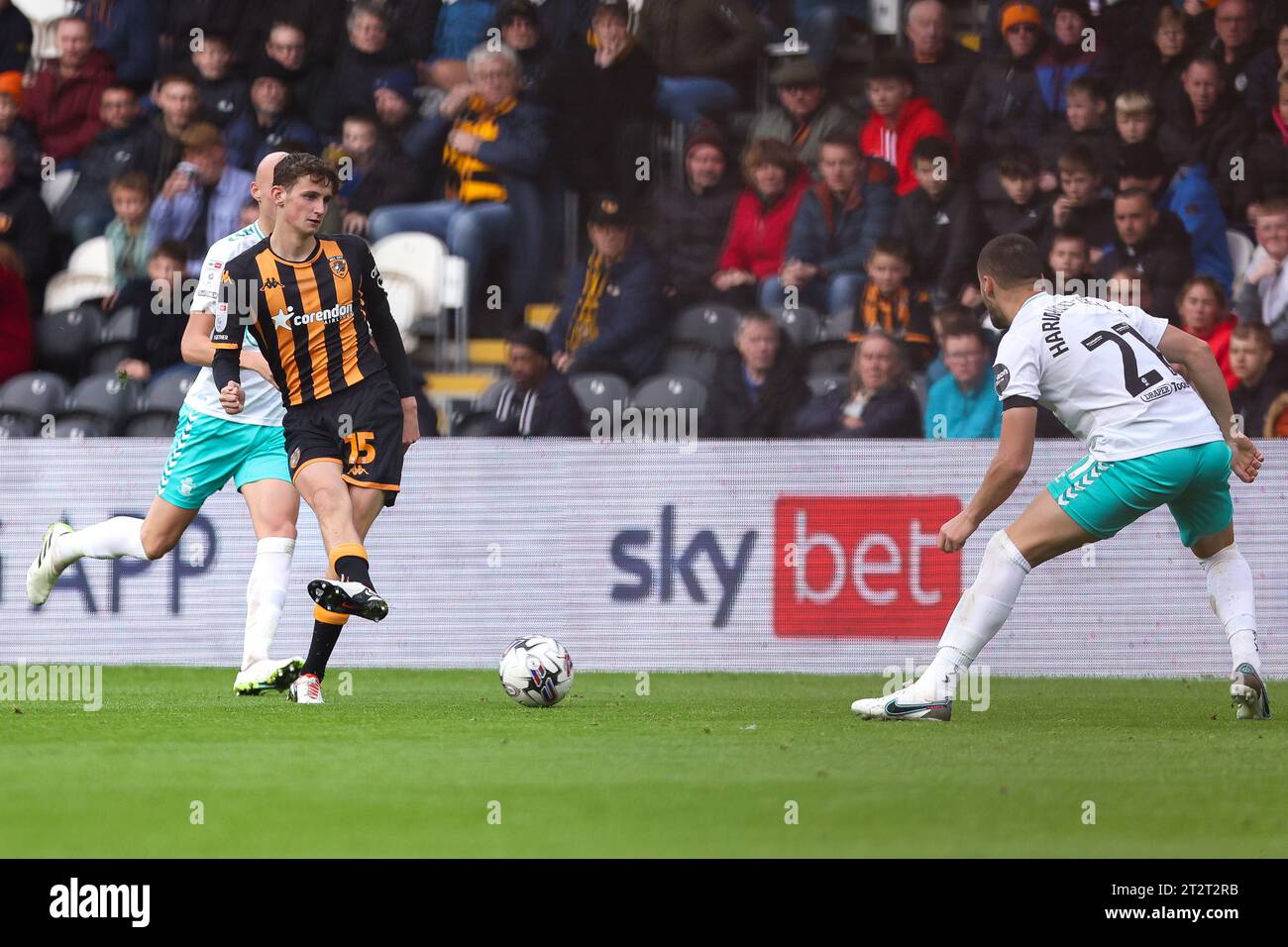Tyler Morton of Hull City plays the ball past Taylor Harwood-Bellis of ...
