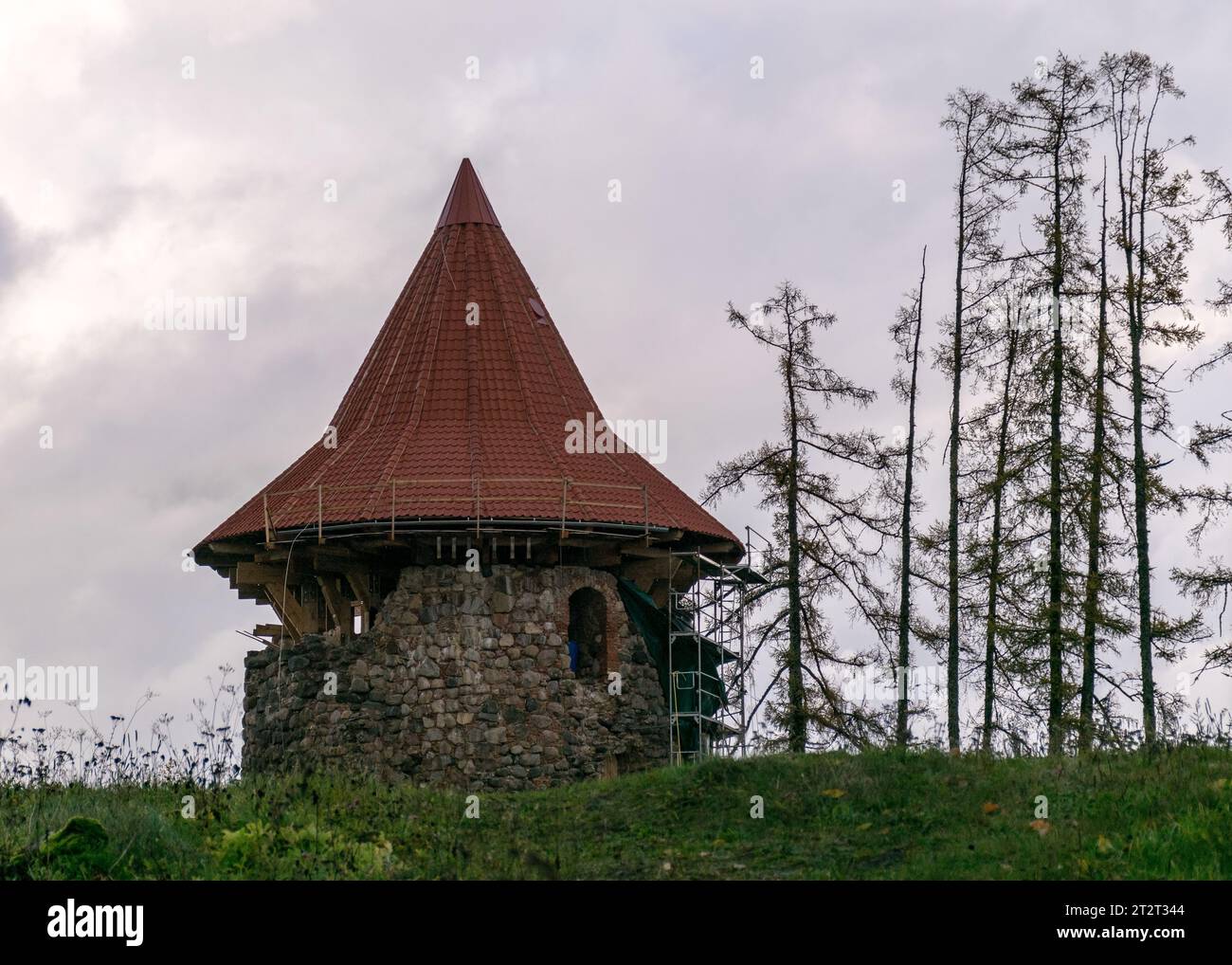 landscape with castle ruins, autumn day, restored tower roof, Ergeme ...