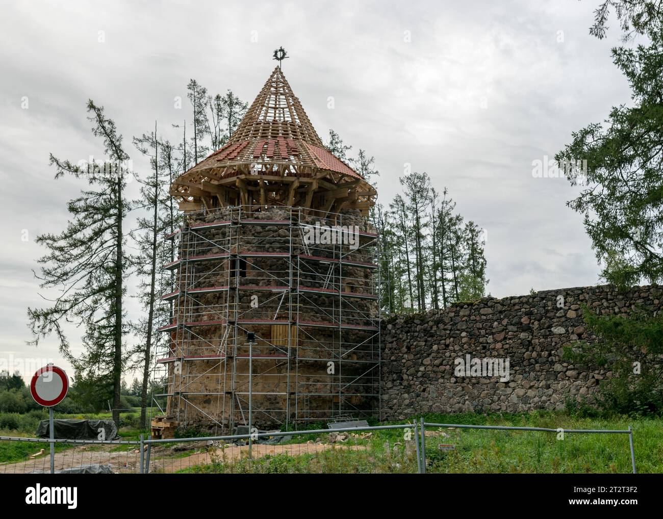 old medieval stone castle ruins, castle tower with new roof structure ...